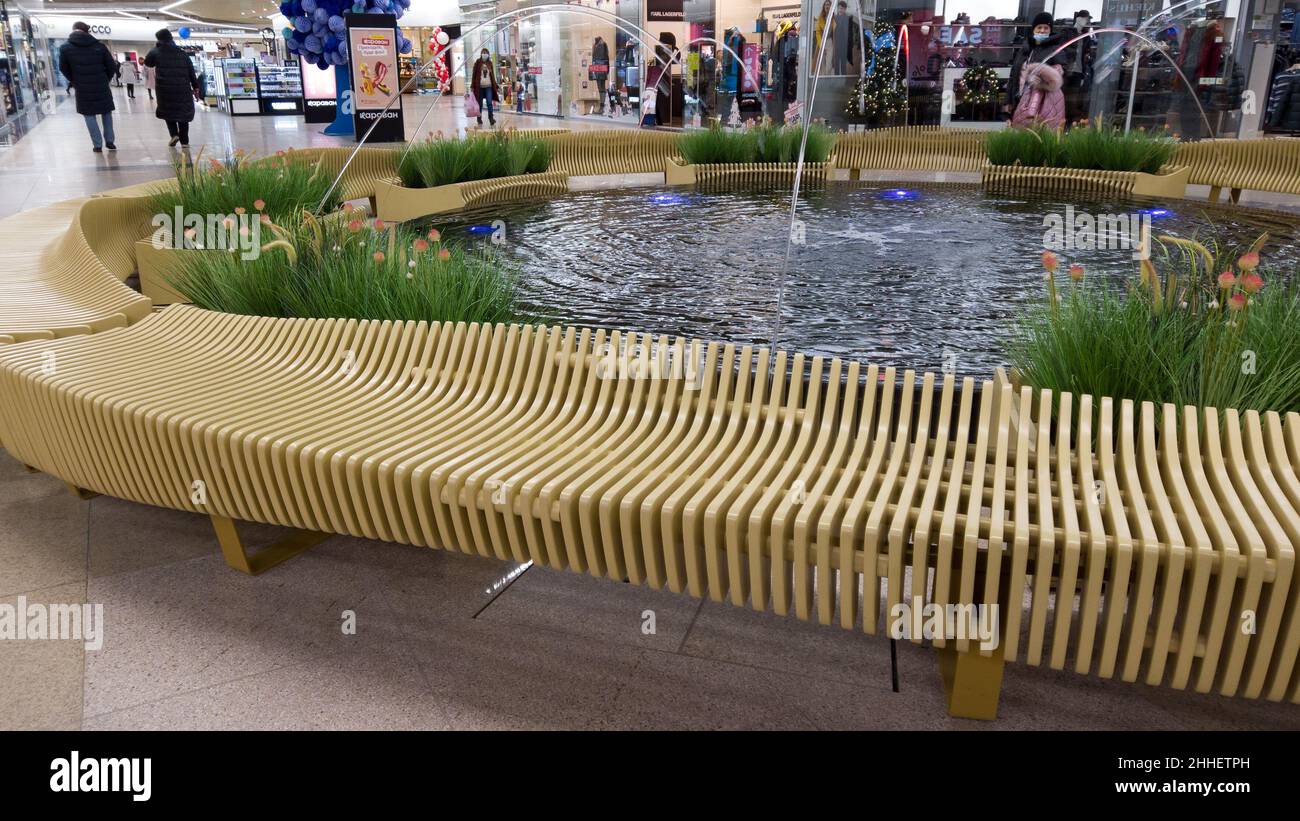 Wooden bench in the shopping mall. Recreation area in the shopping ...