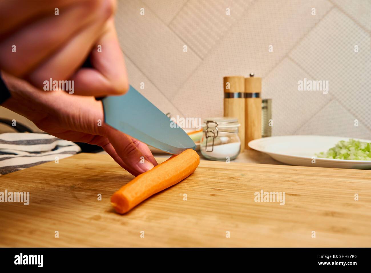 Woman chopping carrot close hi-res stock photography and images - Alamy