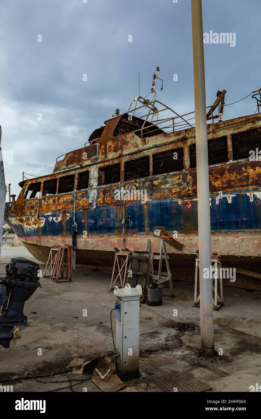 Fire Damaged, Burnt Out Boat at Garrucha Shipyard, Spain Stock Photo ...