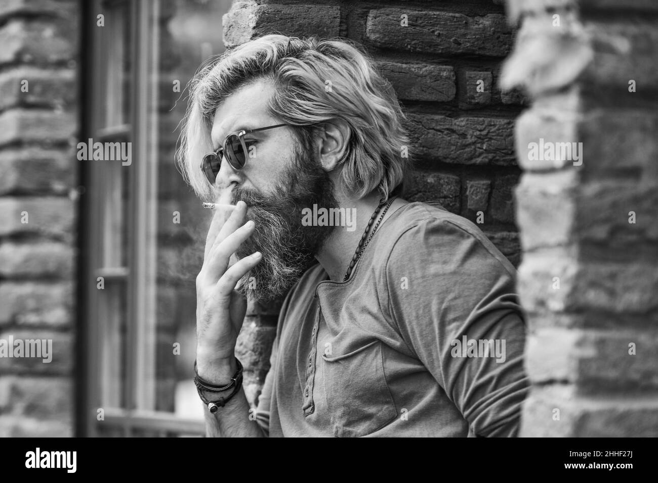 Fashionable mature man with cigarette. Brutal guy sunglasses smoking ...