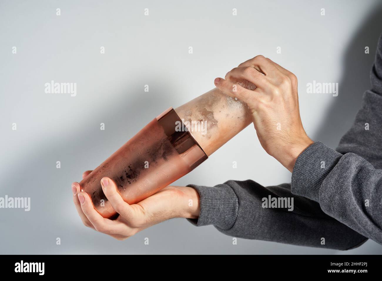 Hands holding cocktail shaker hi-res stock photography and images - Alamy
