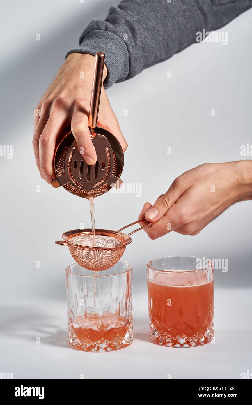Hands holding cocktail shaker hi-res stock photography and images - Alamy