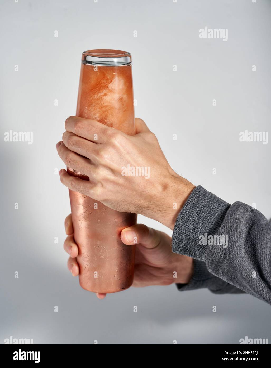 Hands holding cocktail shaker hi-res stock photography and images - Alamy