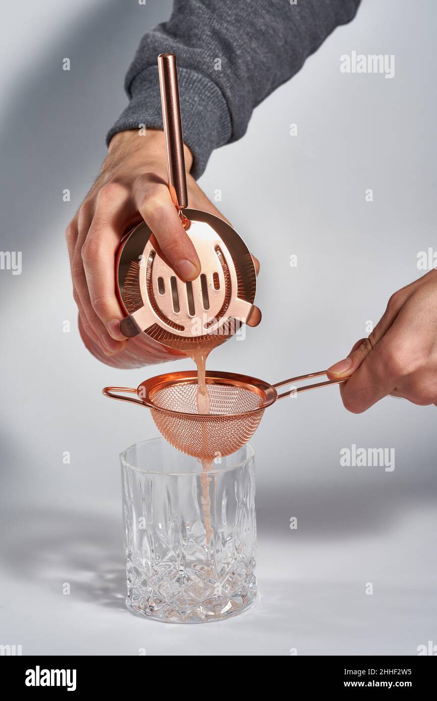 Hands holding cocktail shaker hi-res stock photography and images - Alamy