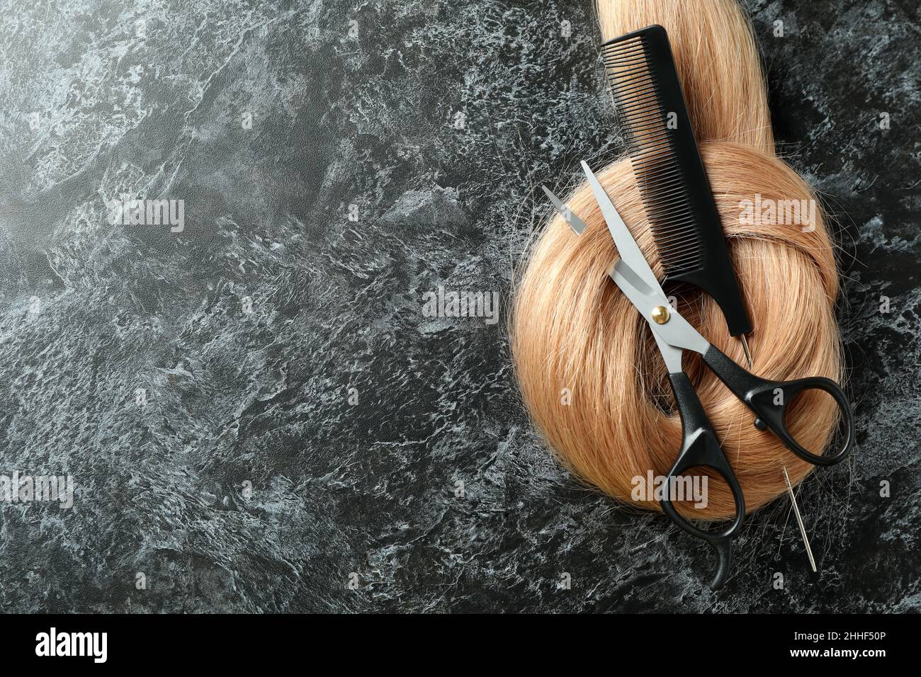 Female hair with scissors and hairbrush on dark background Stock Photo ...