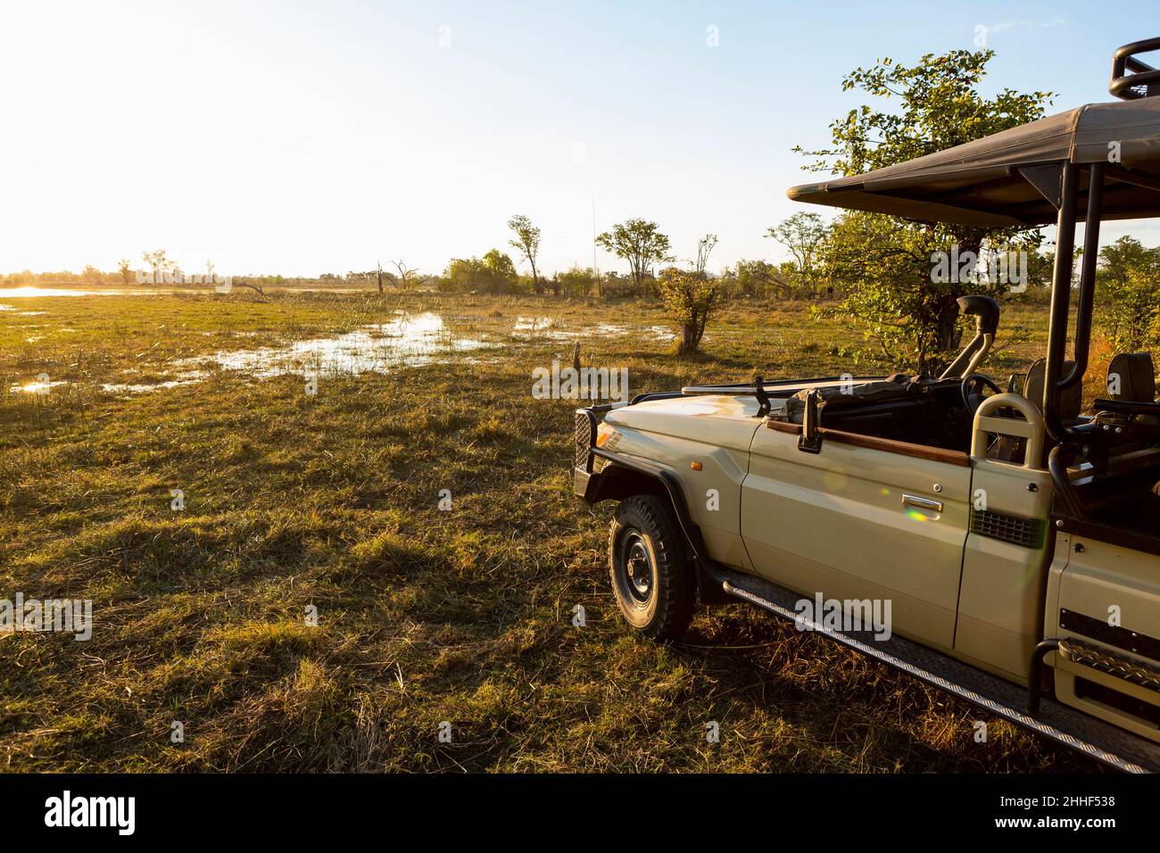 Side of a jeep parked at sunset, looking over the horizon Stock Photo ...