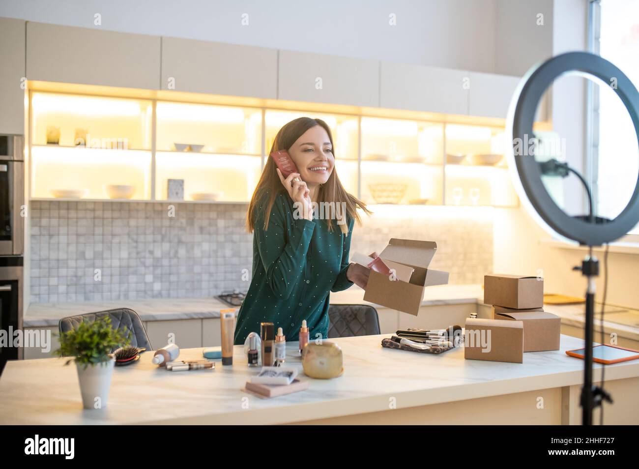 Smiling vlogger demonstrating new hi-res stock photography and images ...