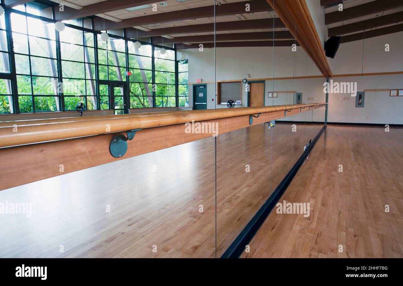 A dance or ballet studio,with a sprung wooden floor. Barre and wall ...