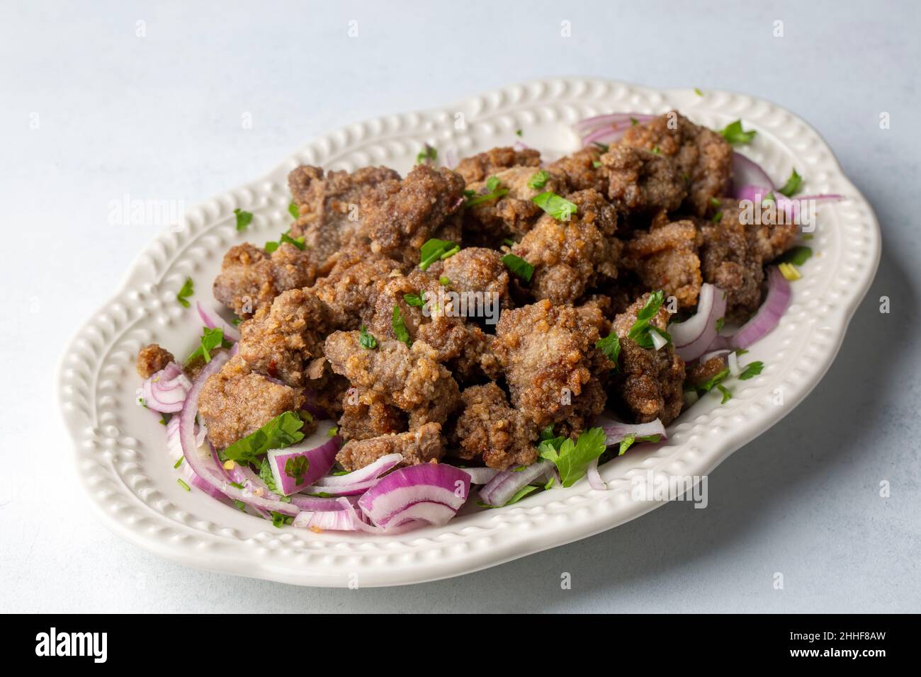 Liver pan (Albanian liver) Turkish traditional food. Liver over rice ...