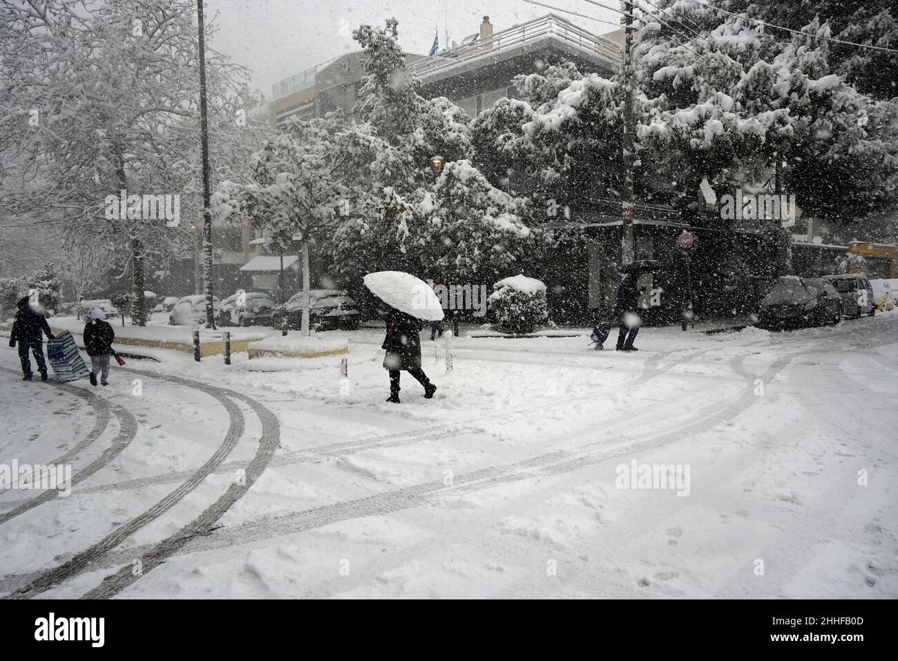 Athens, Greece. 24th Jan., 2022. People walk amidst snowfall in Athens ...