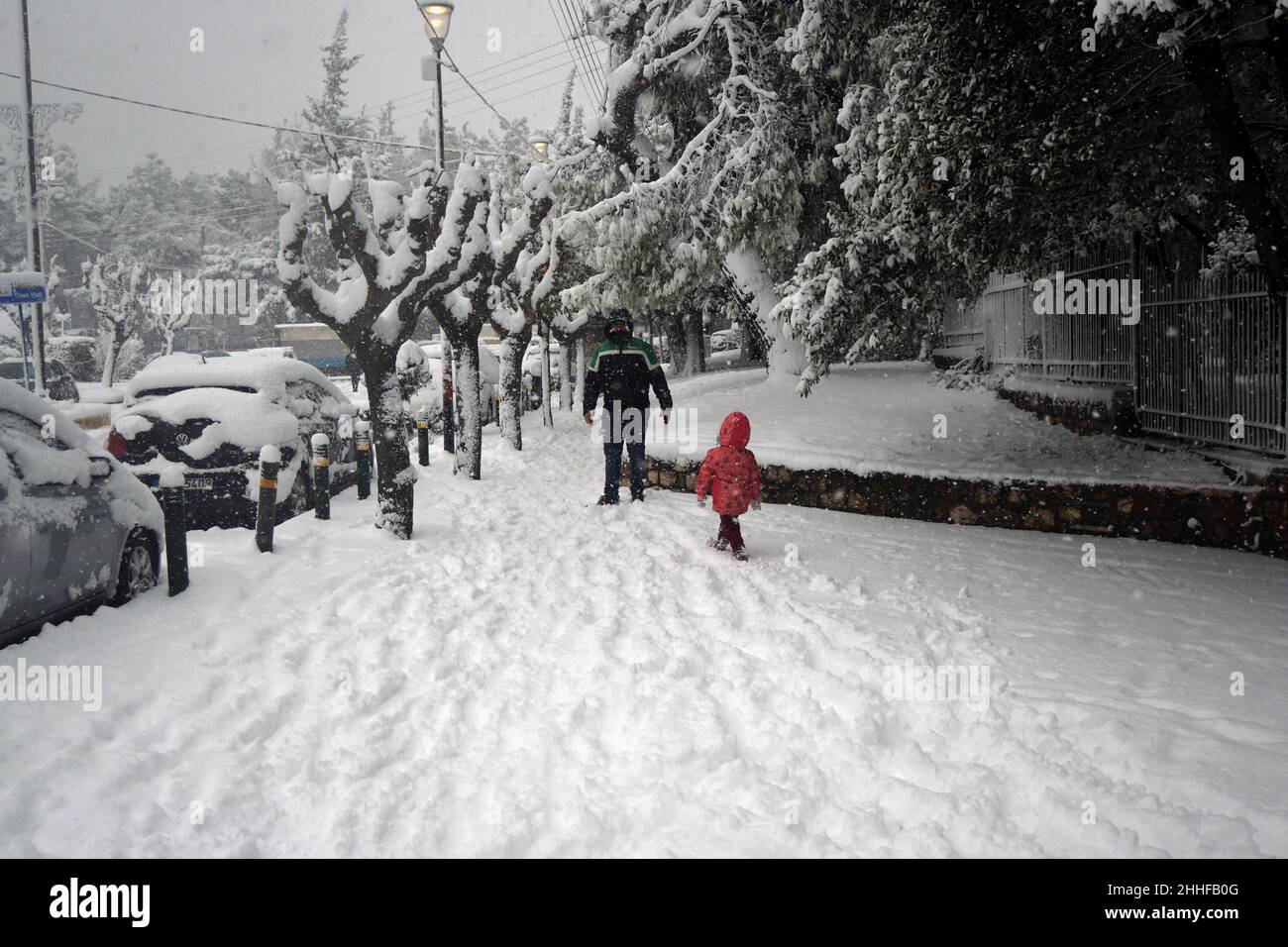 Athens, Greece. 24th Jan., 2022. People walk amidst snowfall in Athens ...
