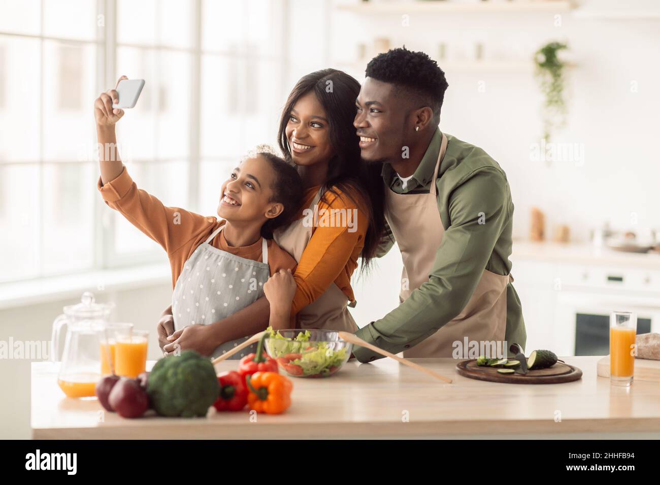 African Family Cooking And Making Selfie On Smartphone In Kitchen Stock ...