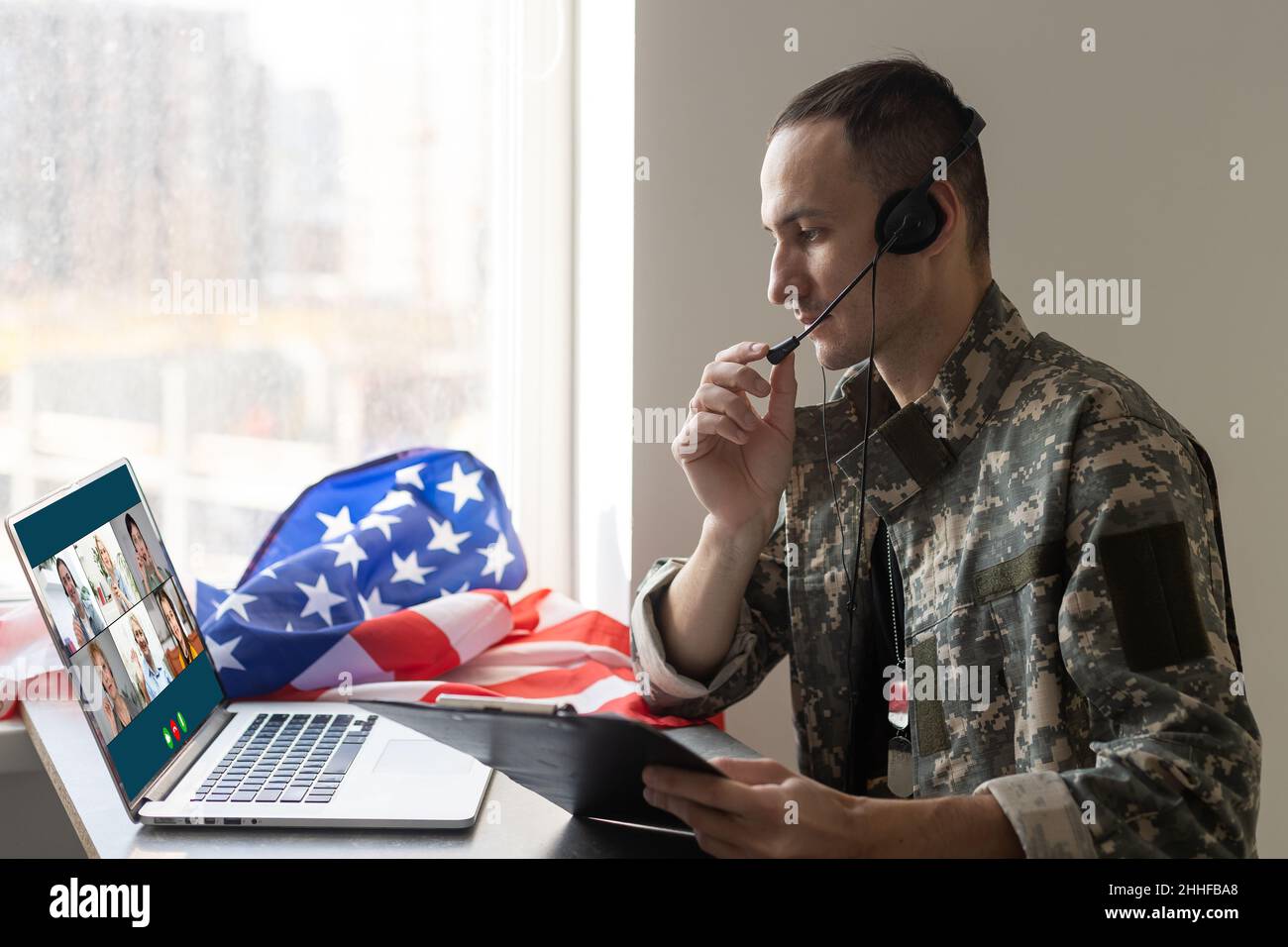 a army speaking video conferencing on computer using online video call ...