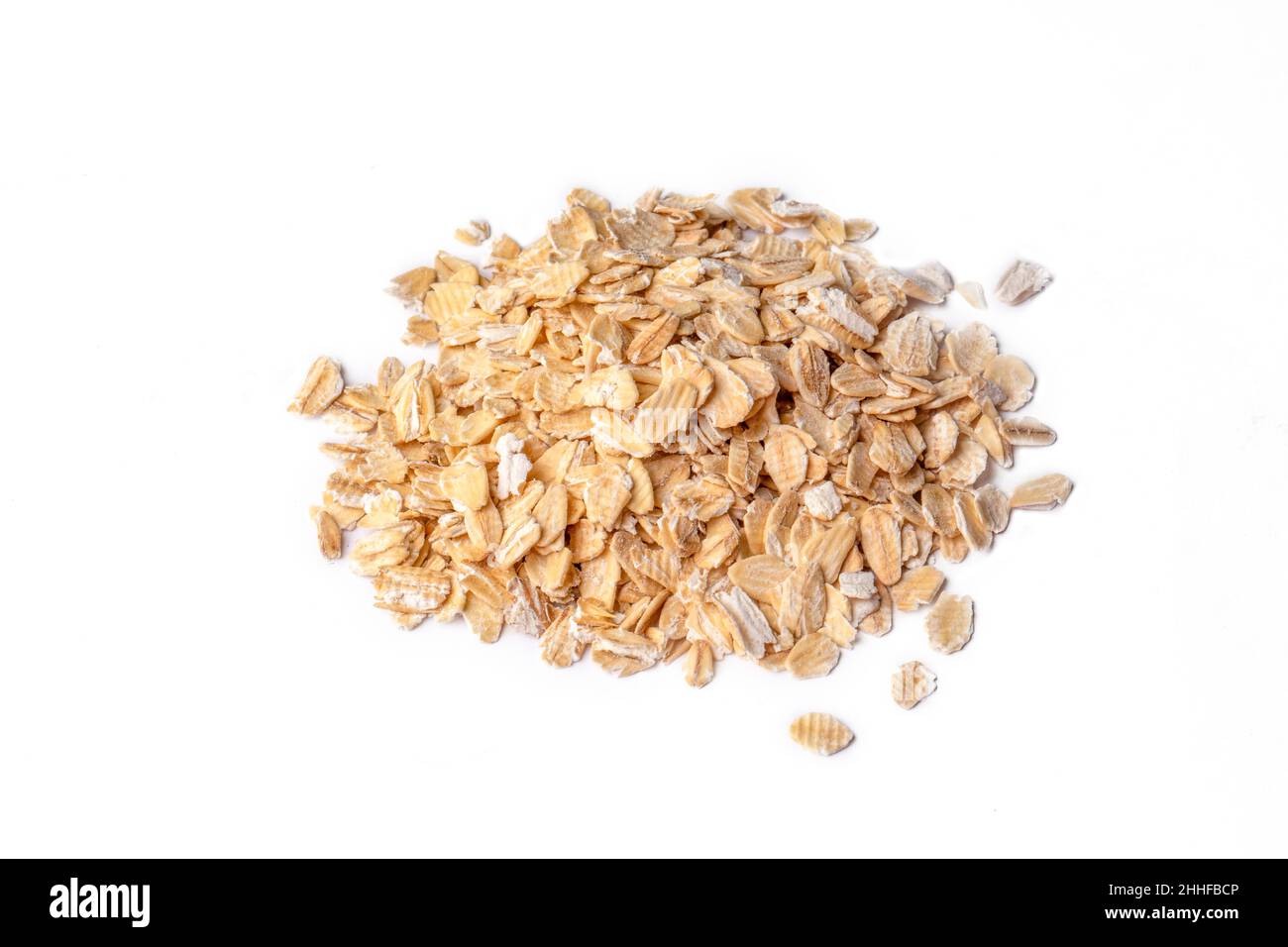 Heap of dry rolled oats isolated Stock Photo - Alamy