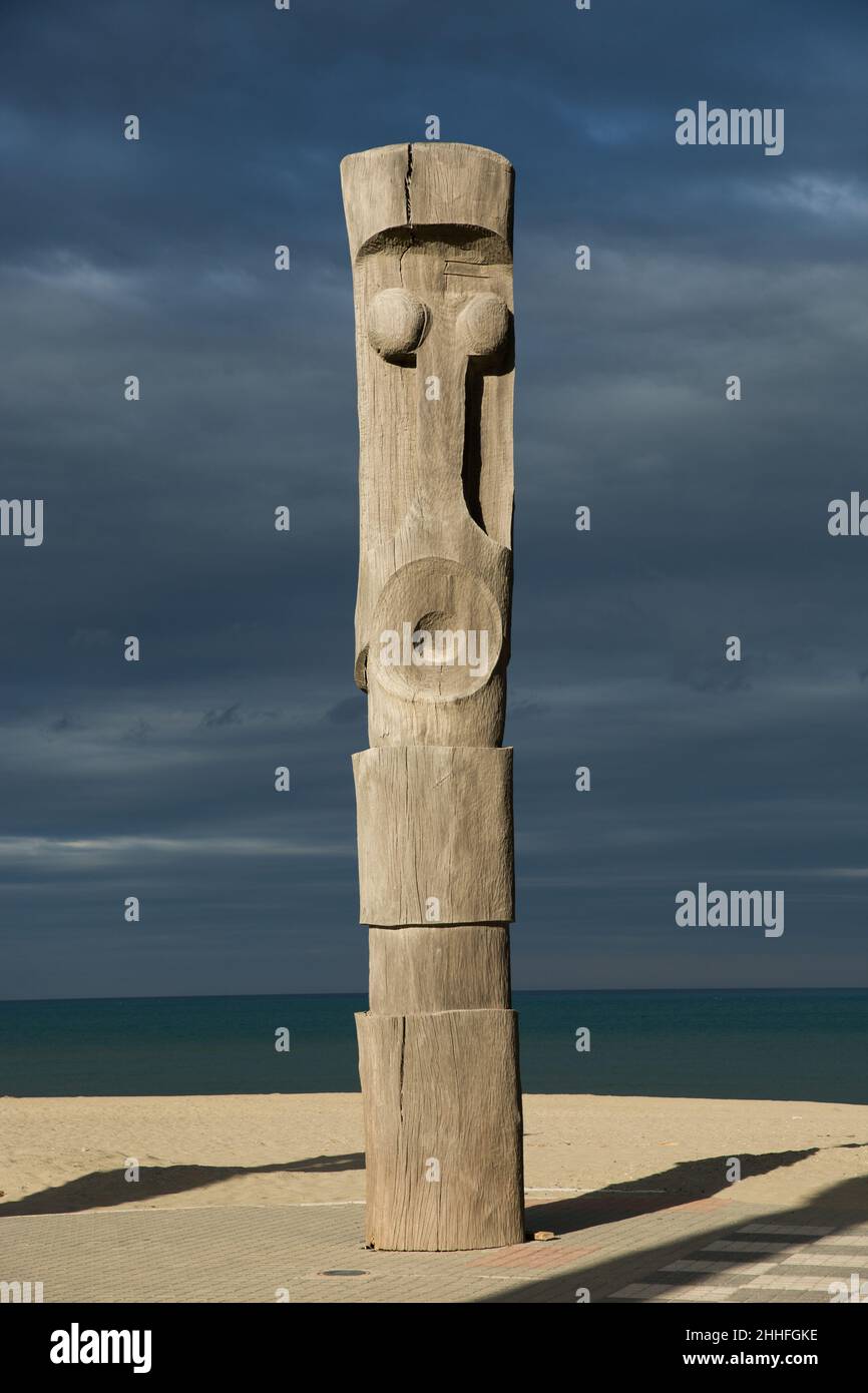 Sunlit Weathered Wooden Totems in Front of the Medirranean Sea in Le ...