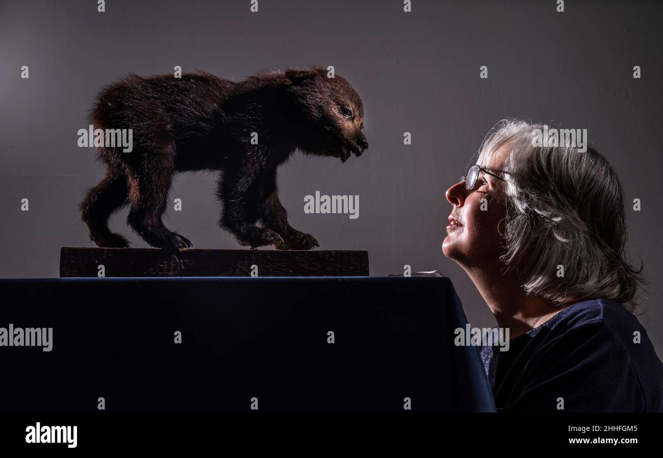 Curator Kitty Ross Abbey with a Himalayan Black Bear cub, that was once ...