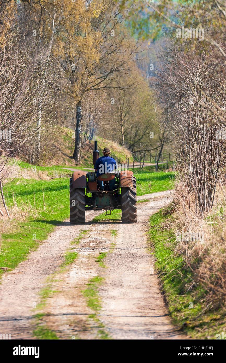 Tractor behind tree hi-res stock photography and images - Alamy