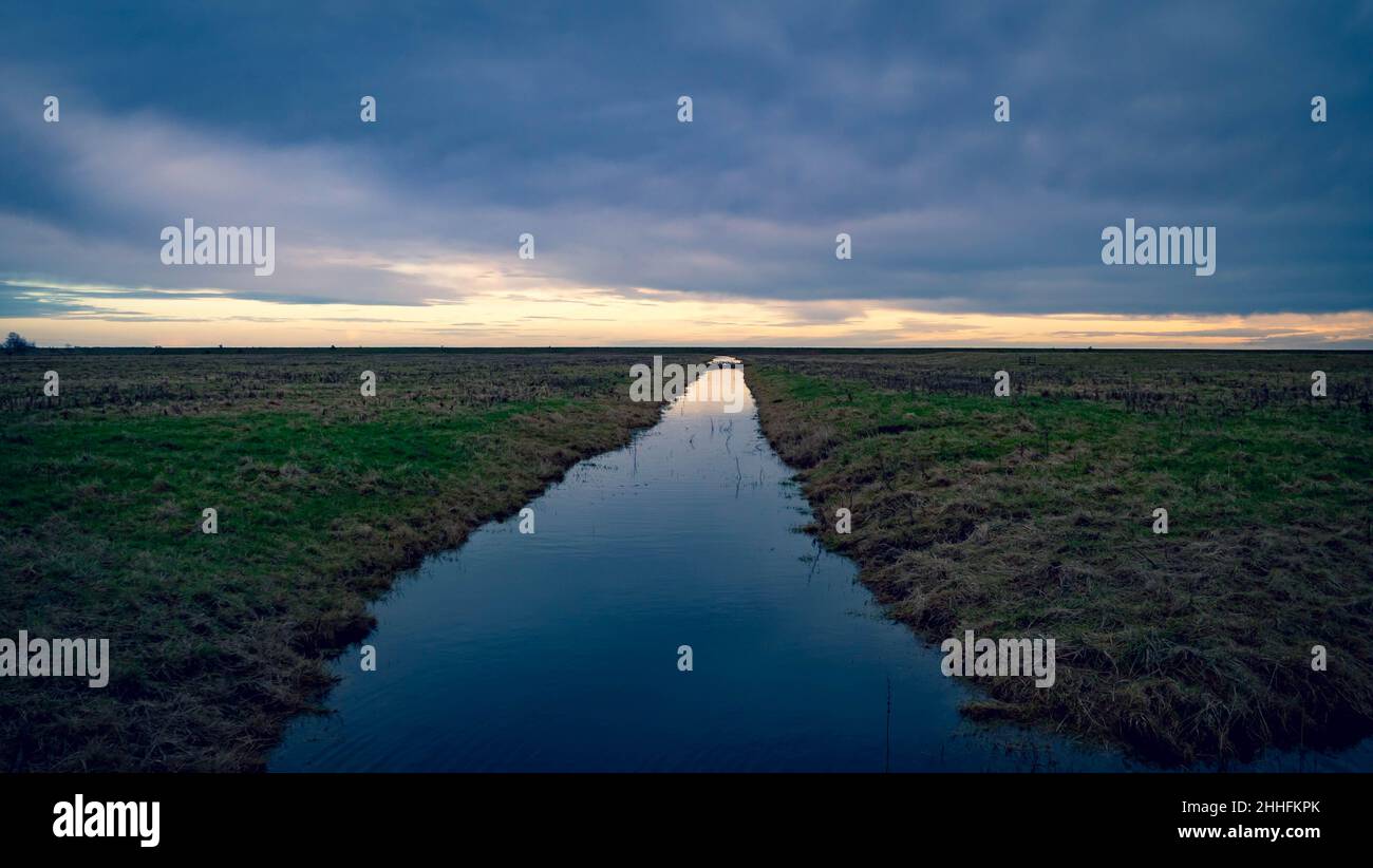 Freiston Shore, Boston, Lincolnshire. Dark clouds and bright golden ...
