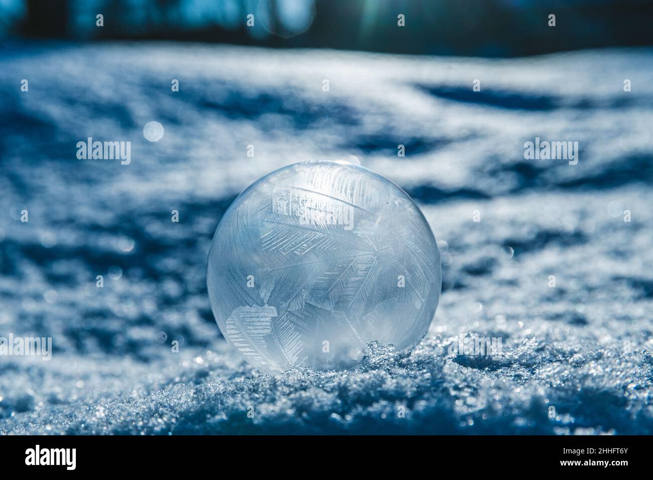 frozen soap bubble in winter on snow. magic nature Stock Photo - Alamy