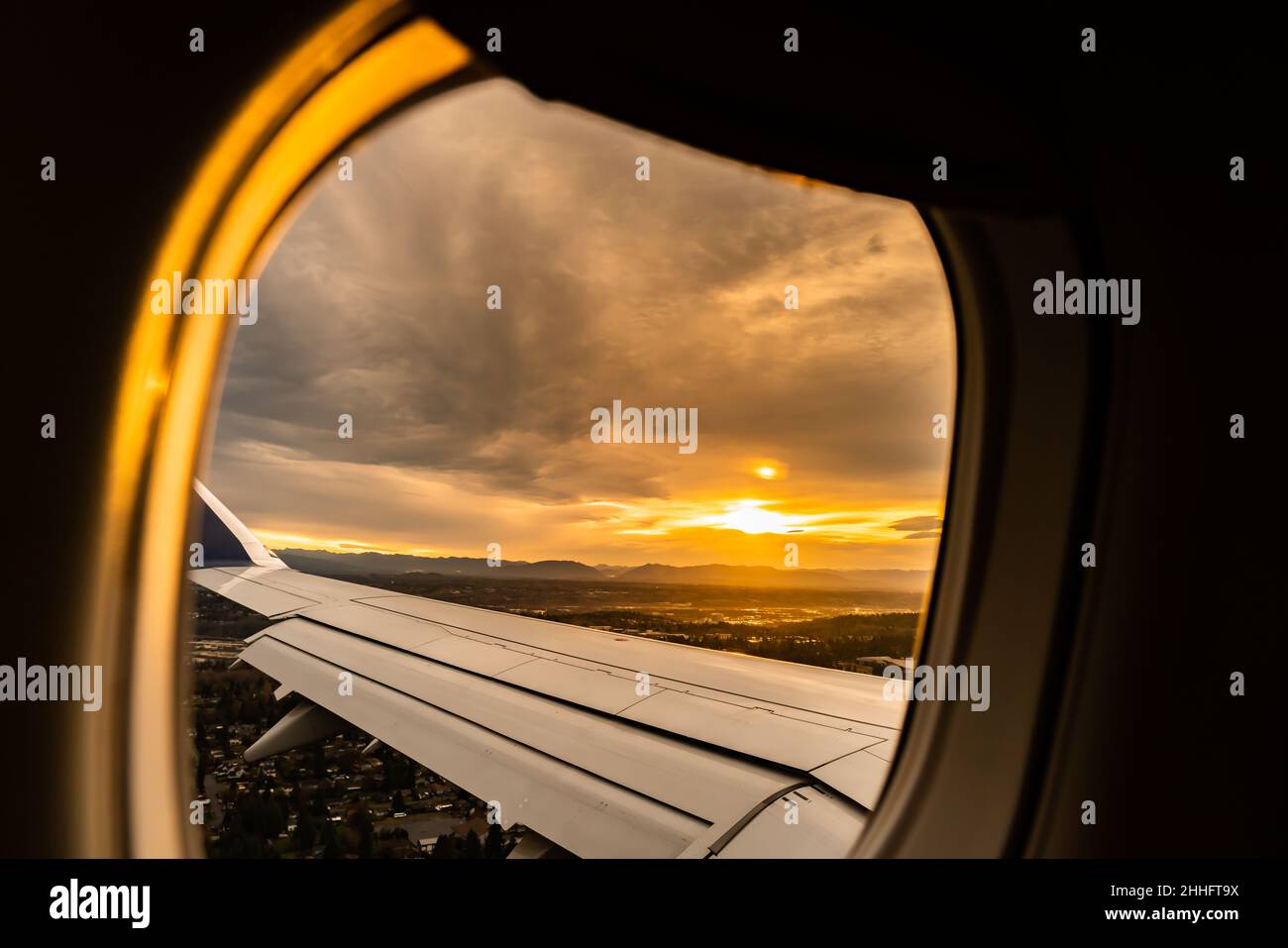 Airplane window with Sunrise beautiful view over Seattle, United States ...