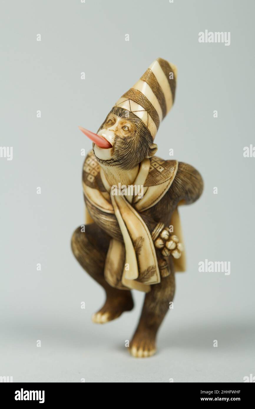 Netsuke of Monkey Wearing a Tall Cap and Carrying a Fan 19th century ...