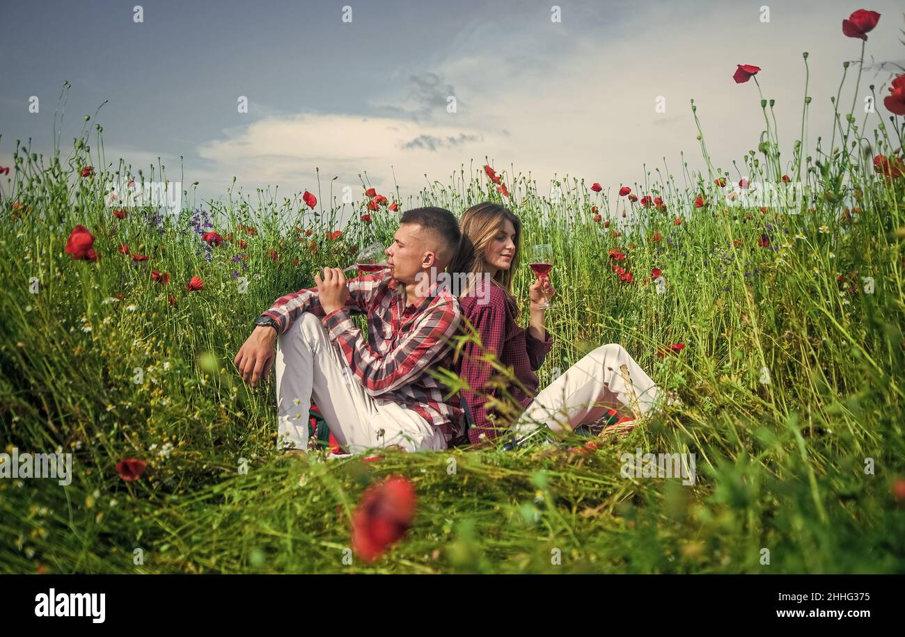 Young couple enjoying the time together in the red meadow, romance ...