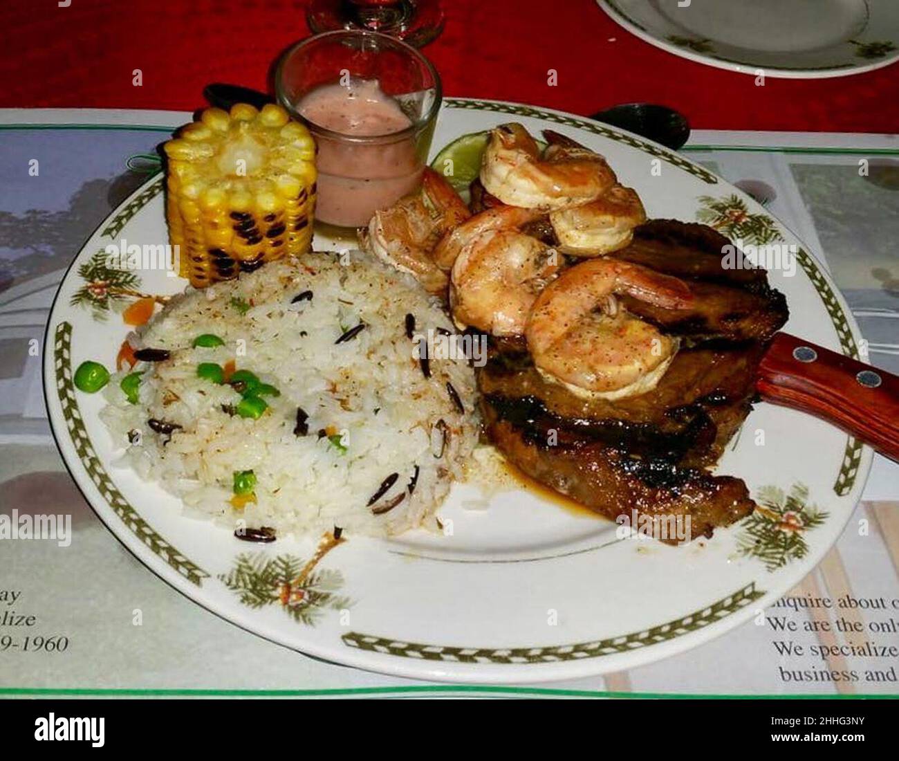 Steak and shrimp with rice and beans Stock Photo - Alamy