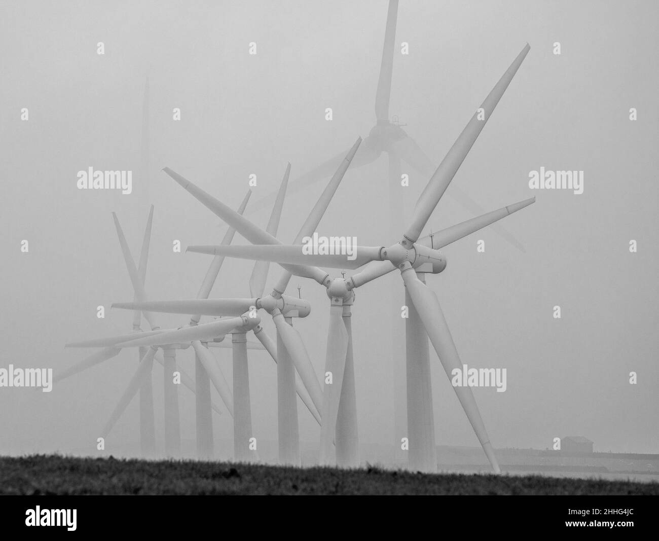 Wind turbines in Fog Stock Photo - Alamy
