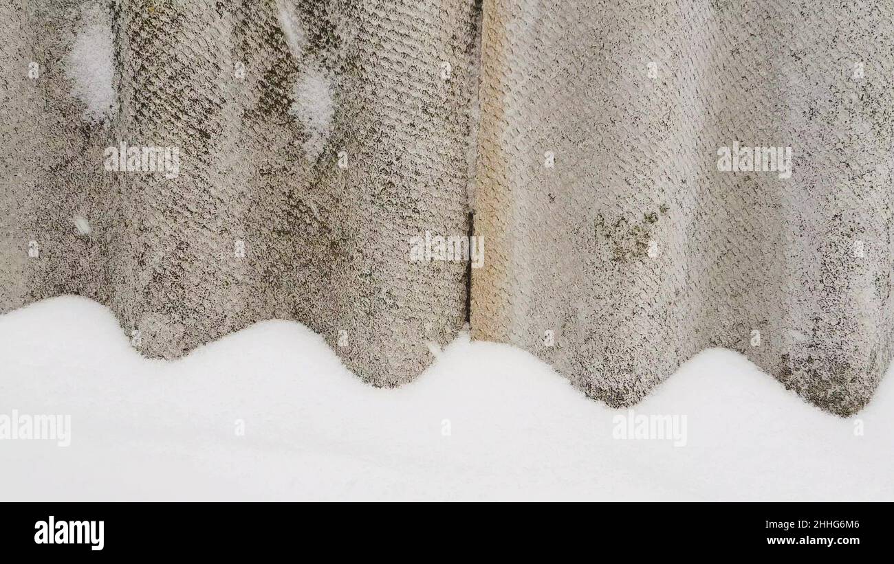 Grey slate asbestos cement sheet close-up with snow in snowy day Stock ...