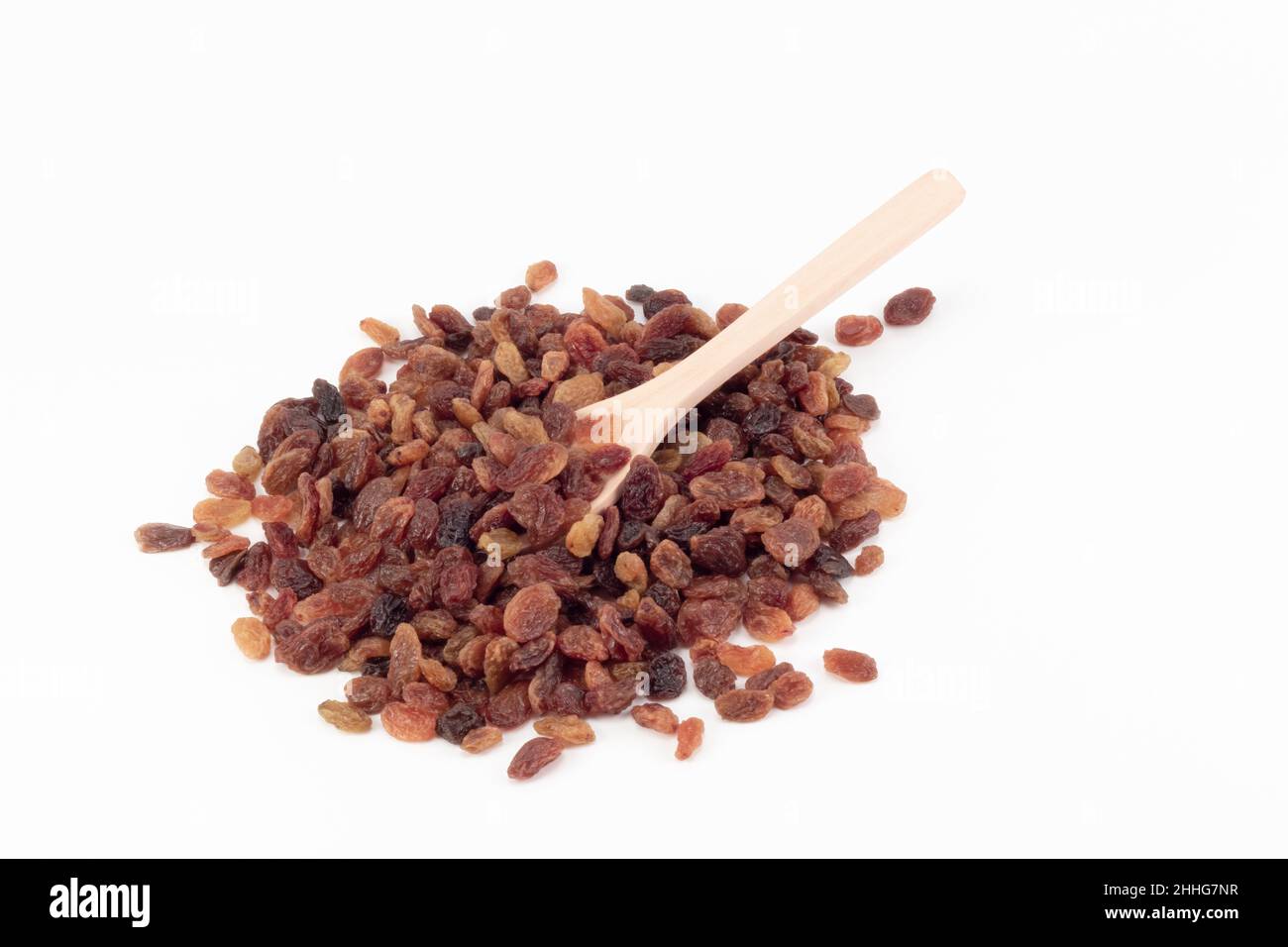 Dried grapes, raisins on a white background Stock Photo - Alamy
