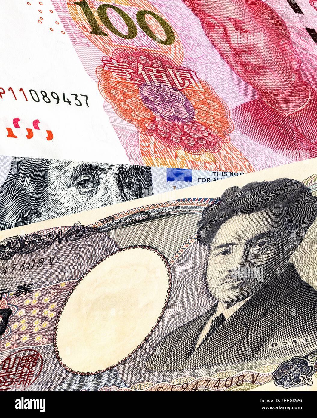 Chinese yuan, Japanese yen and American dollar banknotes close up ...