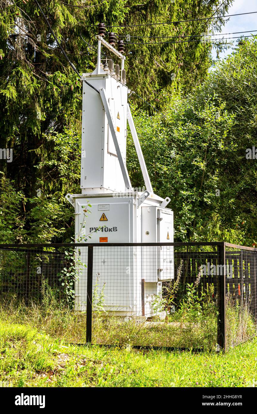 Voltage power transformer substation at the countryside in Russian ...