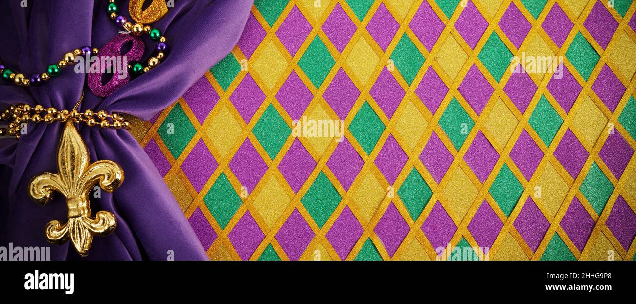 Frame of Mardi Gras Mask and colorful Mardi Gras Beads on diamond ...