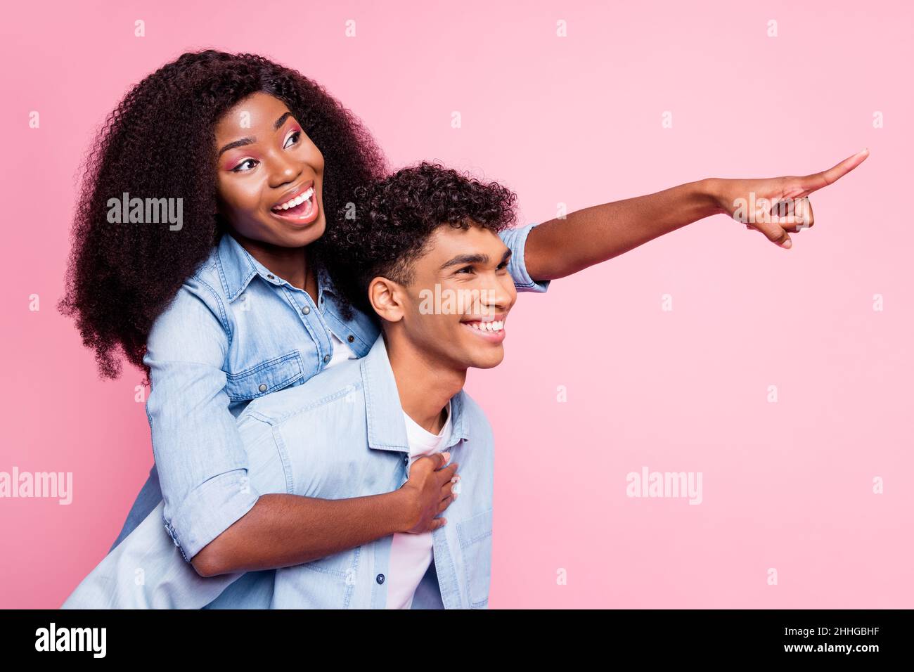 Profile photo of guy piggyback attractive dark skin lady indicate ...
