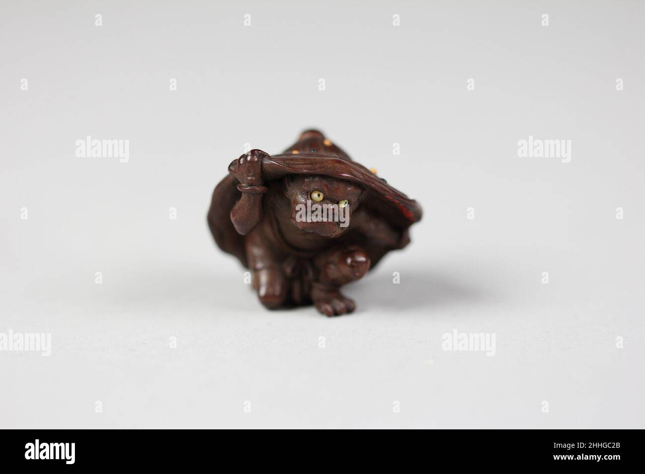 Netsuke of Demon under a Lotus 19th century Japan. Netsuke of Demon ...