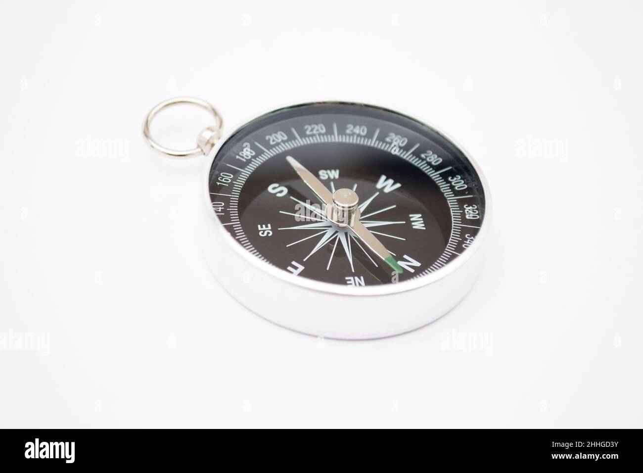 Compass at isolated white background Stock Photo - Alamy