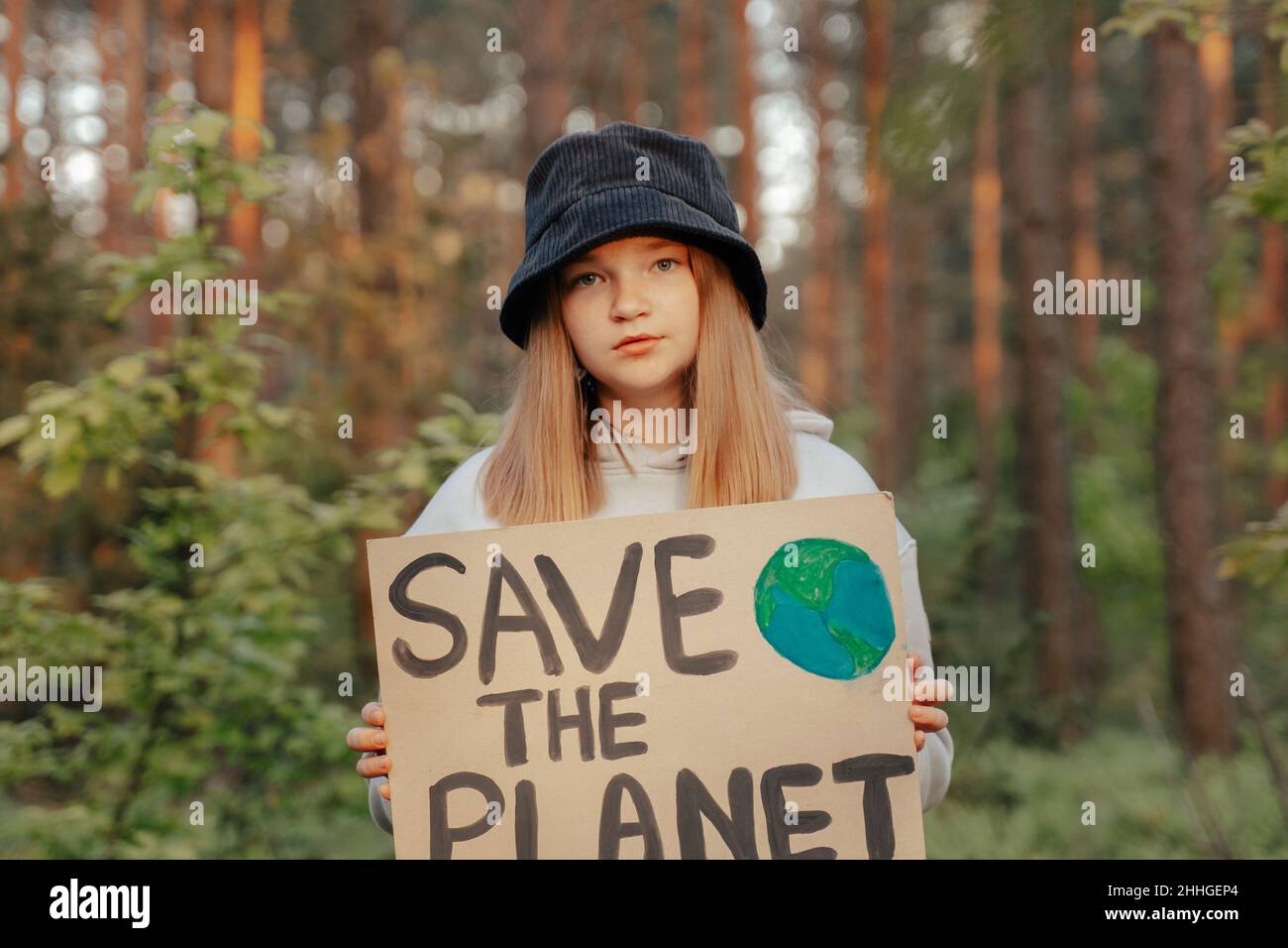Save the Planet banner holding in young children hands. Inspiring teen ...