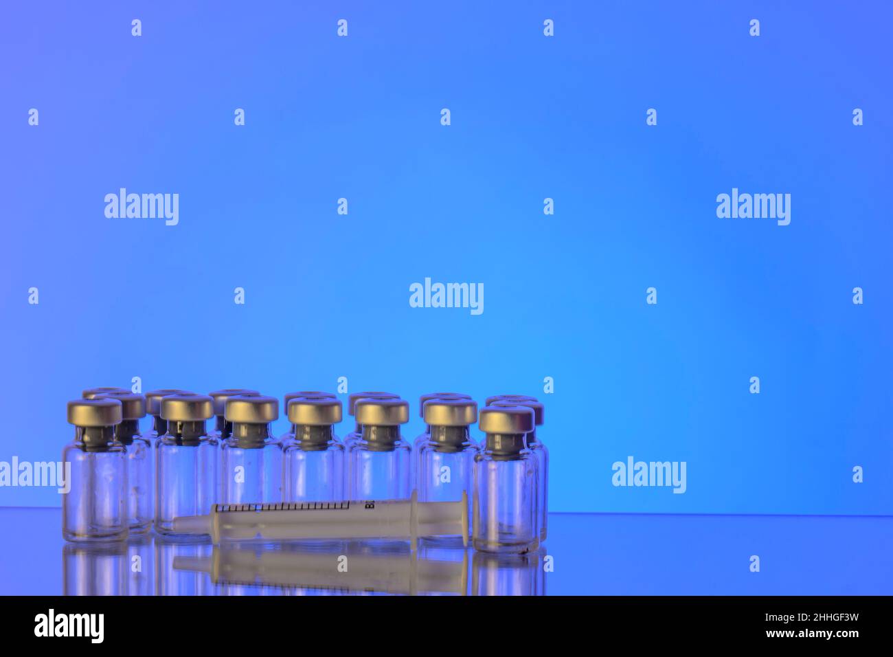 Transparent glass injection bottles with cap and syringe Stock Photo ...