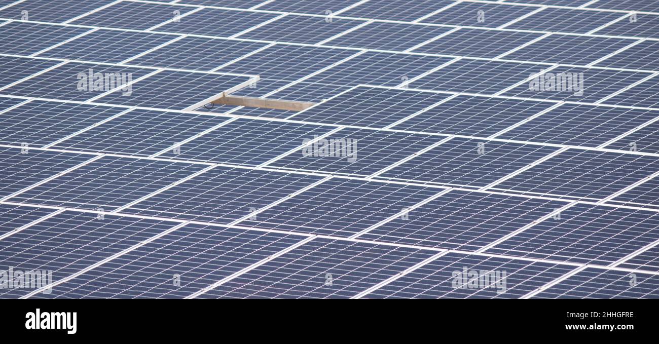 Focus on front a arranged solar photovoltaic panels Stock Photo - Alamy