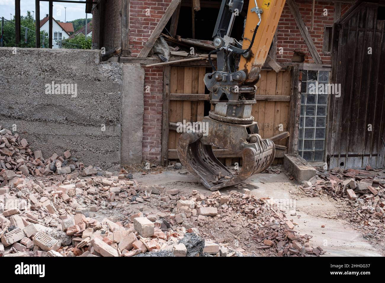 a construction site with broken bricks on the floor and the large metal ...