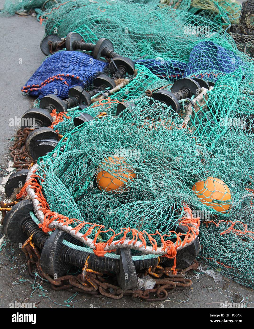 Some Fishing Nets and Floats Laying on a Quayside Stock Photo - Alamy