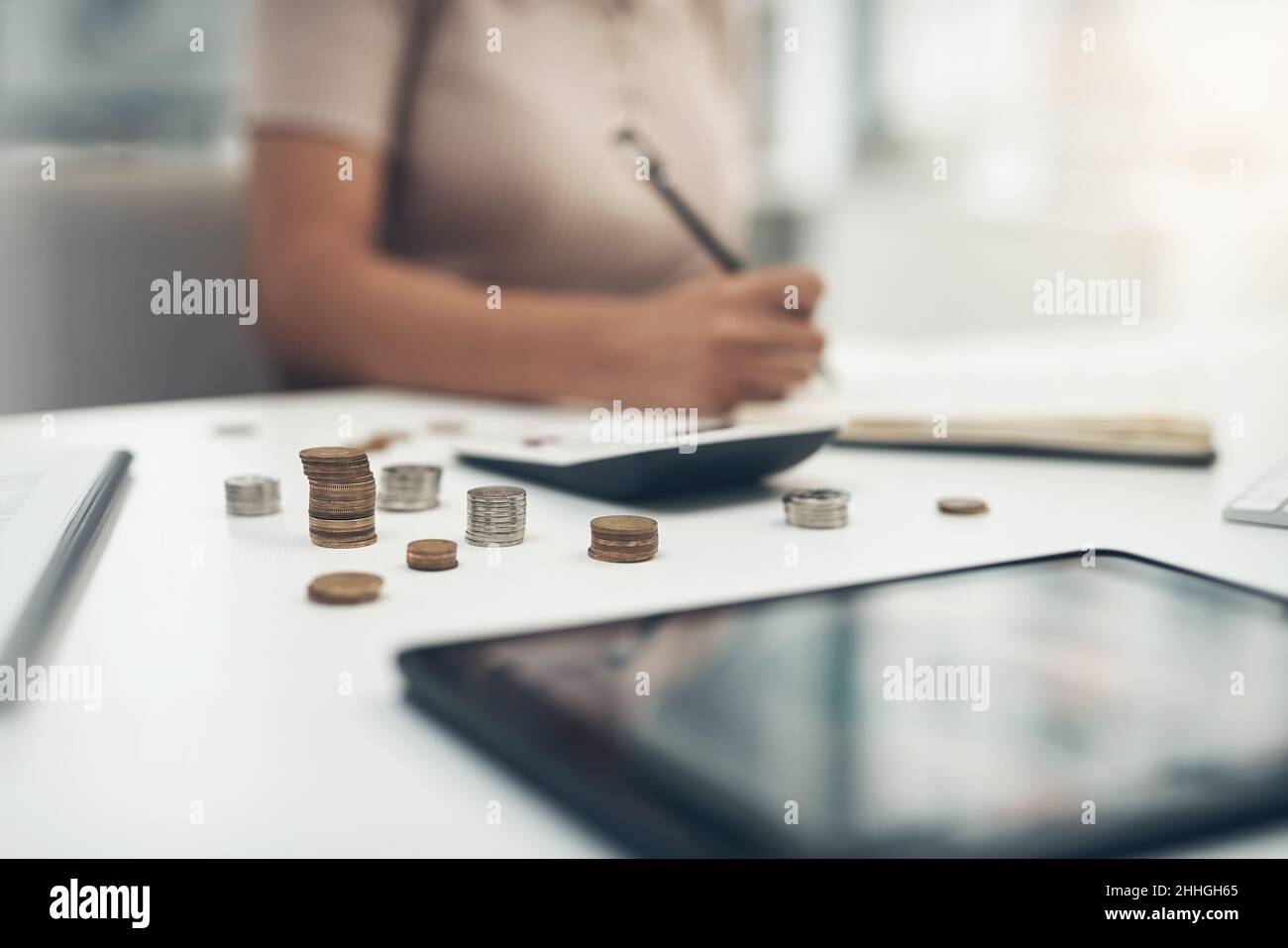 Working on her financial goals. Closeup shot of an unrecognisable ...
