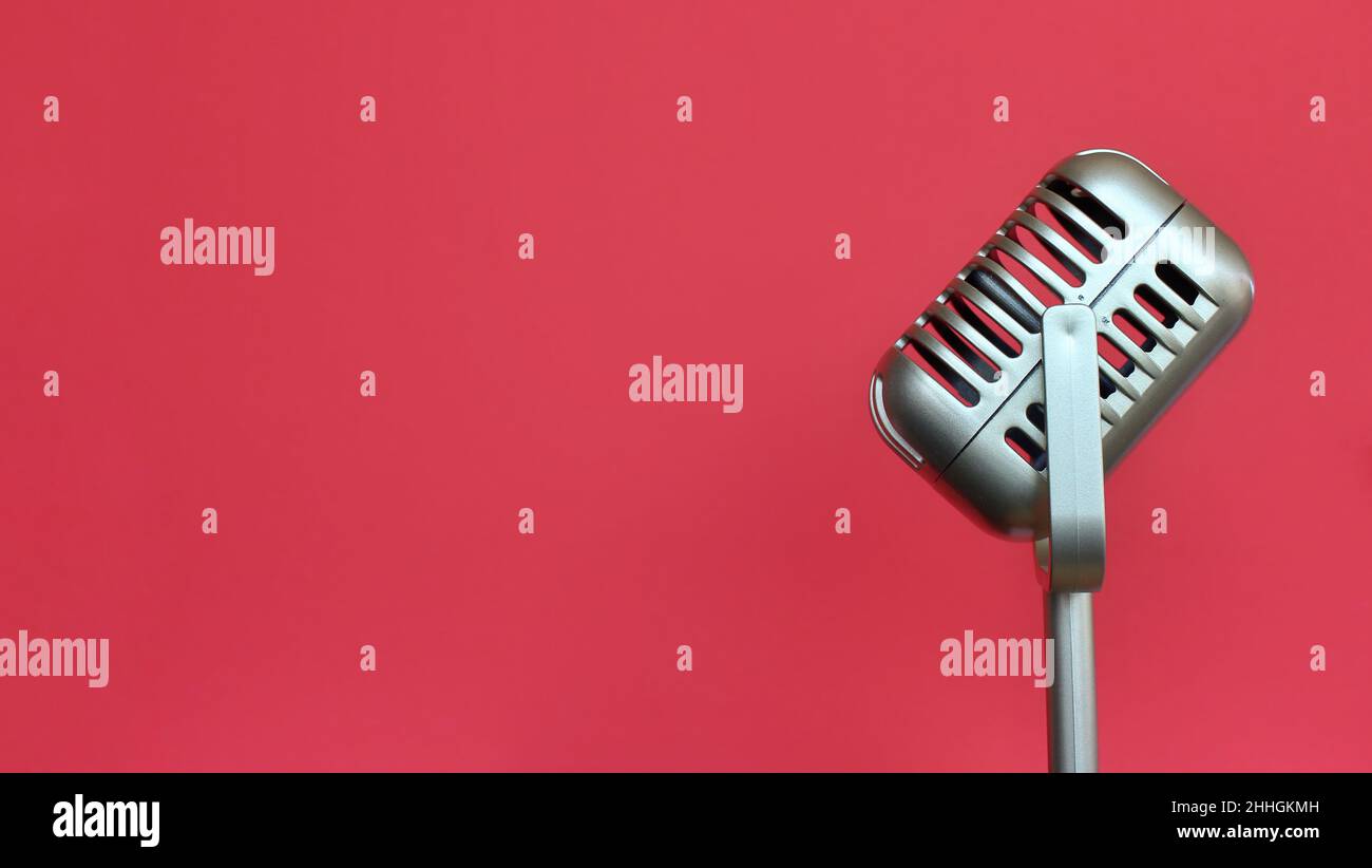 Vintage and retro concept. Vintage classic microphone on red background ...
