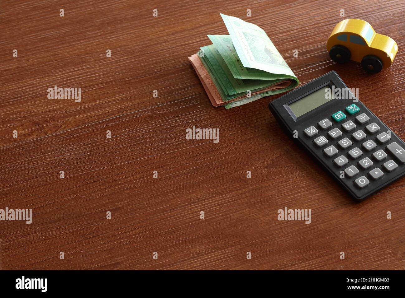Car, transportation cost calculation concept. Toy car, banknotes and ...