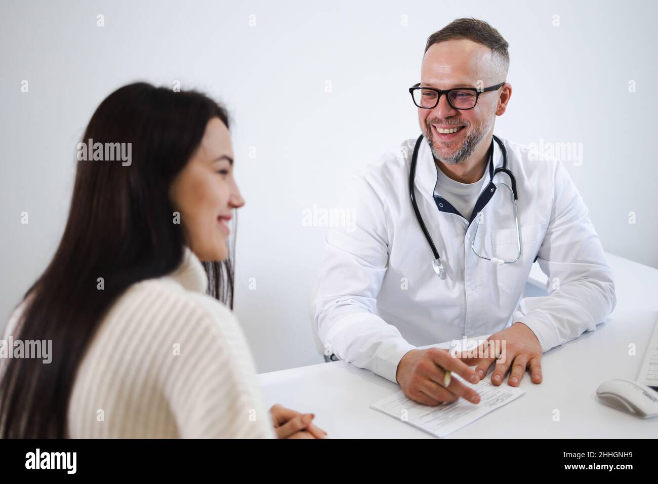 Woman during medical examination in doctor's office Stock Photo - Alamy
