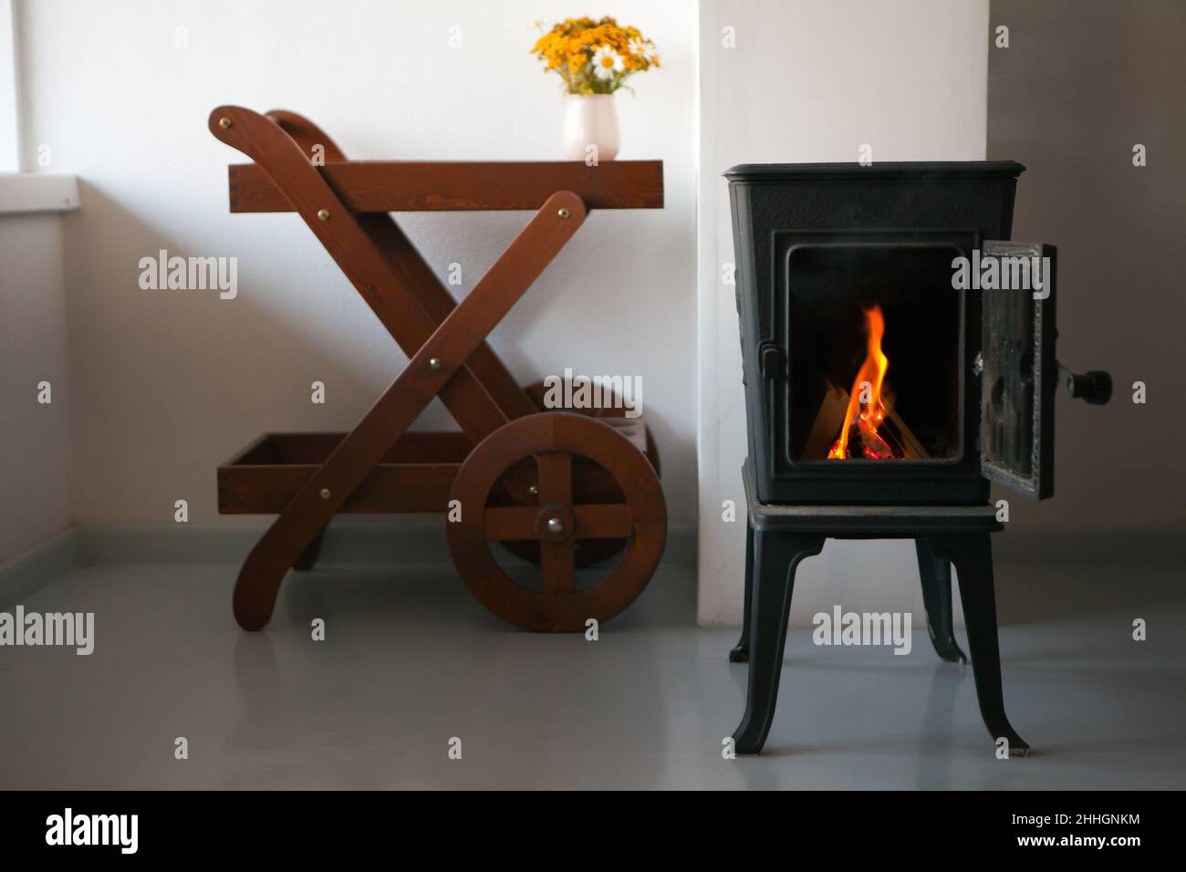 Bright living room interior with fireplace. chimney made of metal ...