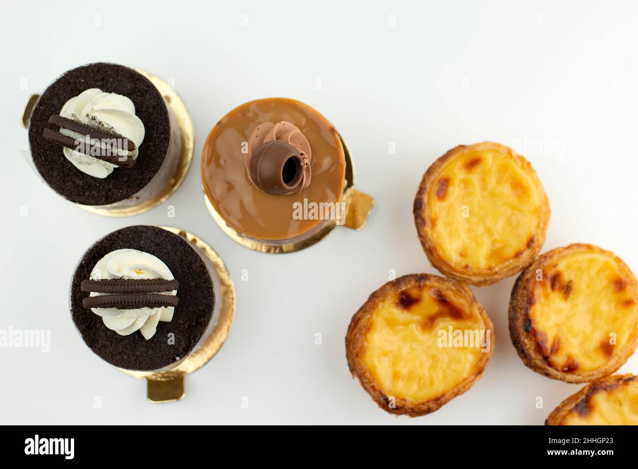 Baked round sweets top view on white background Stock Photo - Alamy