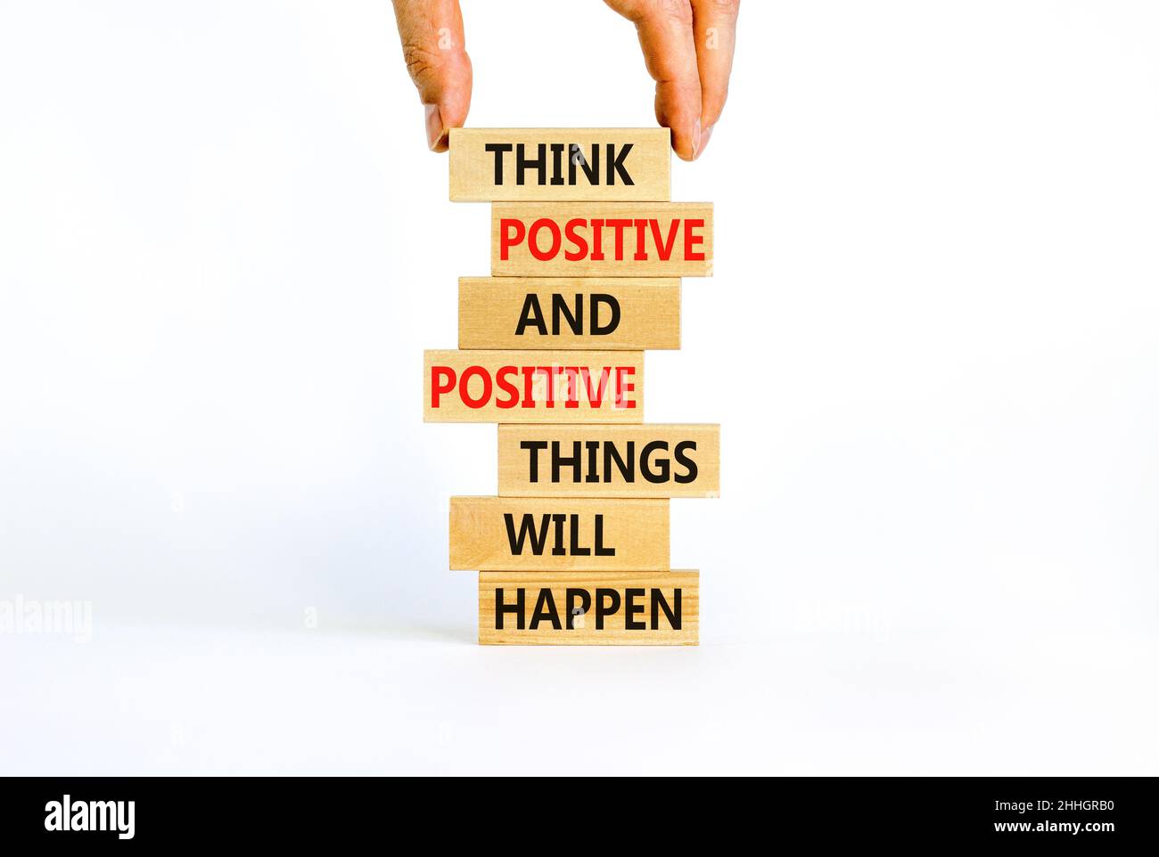 Think positive symbol. Wooden blocks with words Think positive and ...