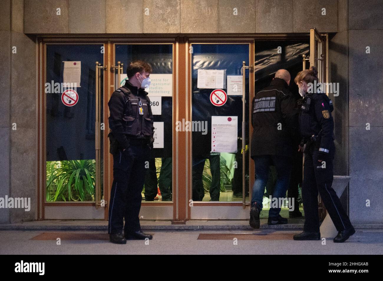 Heidelberg, Germany. 24th Jan, 2022. Police officers enter the building ...