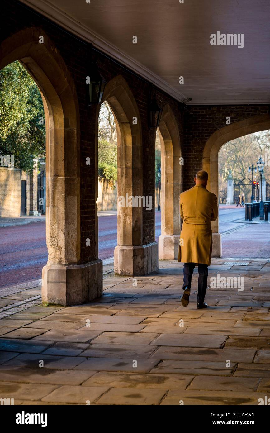 Man walking through the colonnade of St James's Palace, a royal palace ...